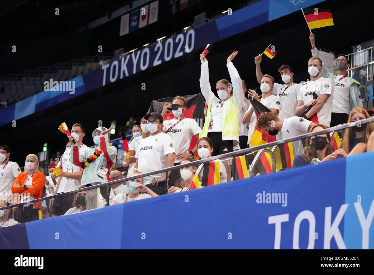 Germany swim team members cheer on their teammates during swimming ...