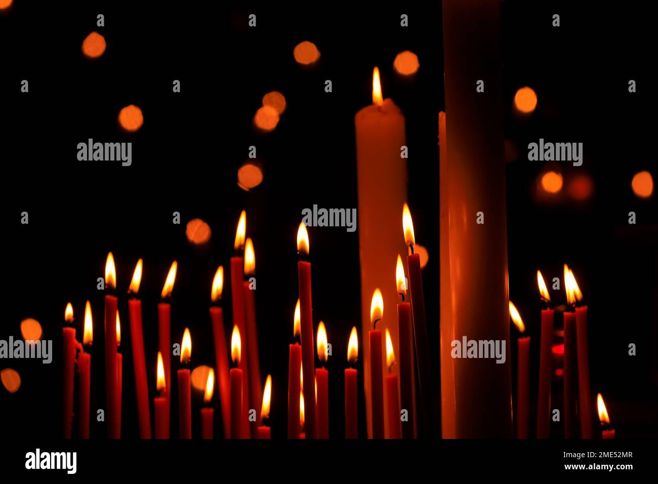 Candles against black background hi-res stock photography and images ...