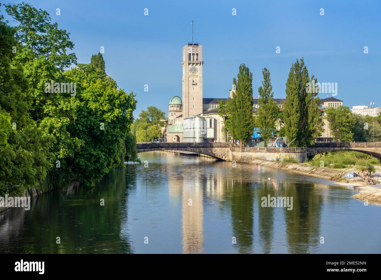 Germany, Bavaria, Munich, Arch bridge over river Isar with tower of ...