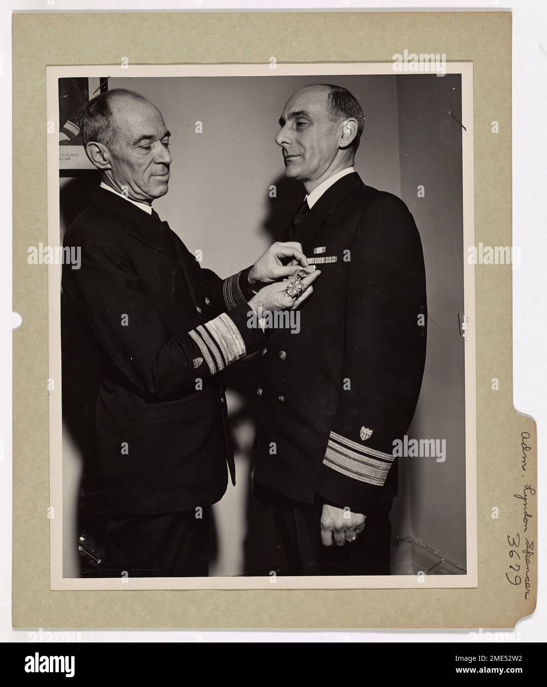 Vice Admiral Russell R. Waesche presents Rear Admiral Lyndon Spencer ...