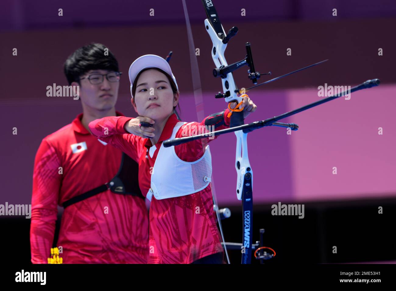 Japan's Azusa Yamauchi releases the arrow as her teammate Japan's ...