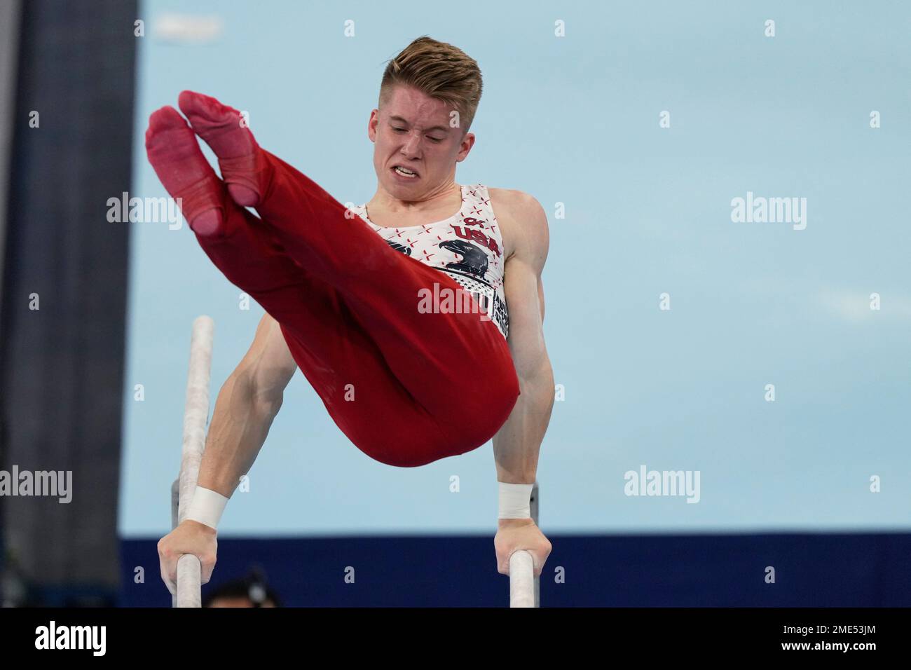 Shane Wiskus, of the United States, performs on the parallel bars ...