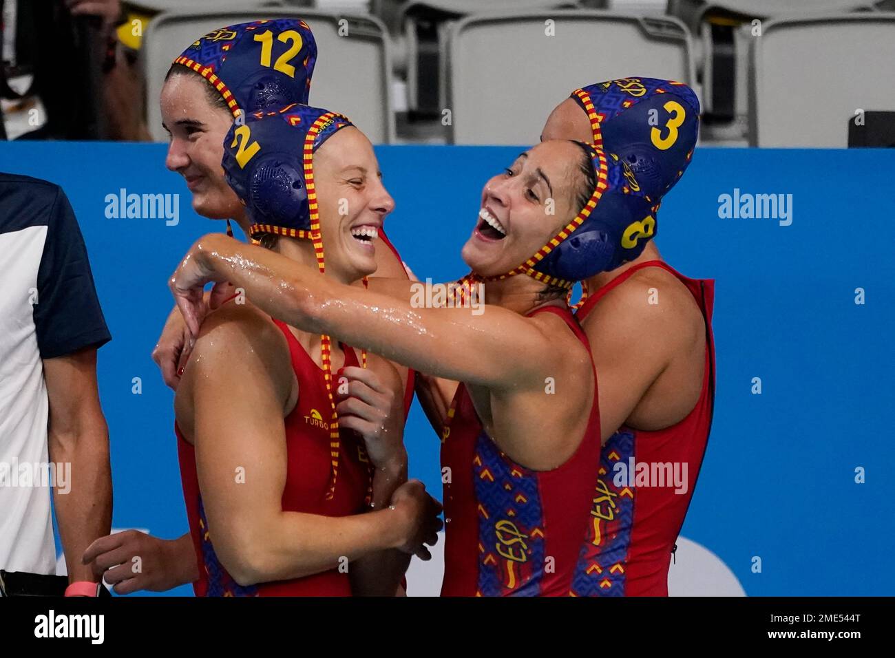 Spain's Marta Bach (2) and Pili Pena (8) celebrate after a win over ...