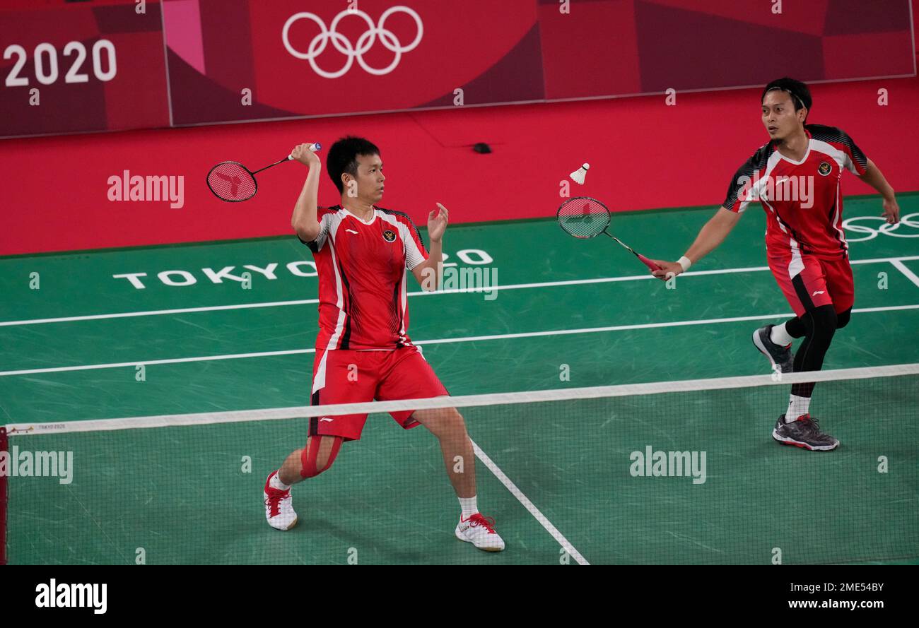 Mohammad Ashsan and Hendra Setiawan, left, of Indonesia compete against ...