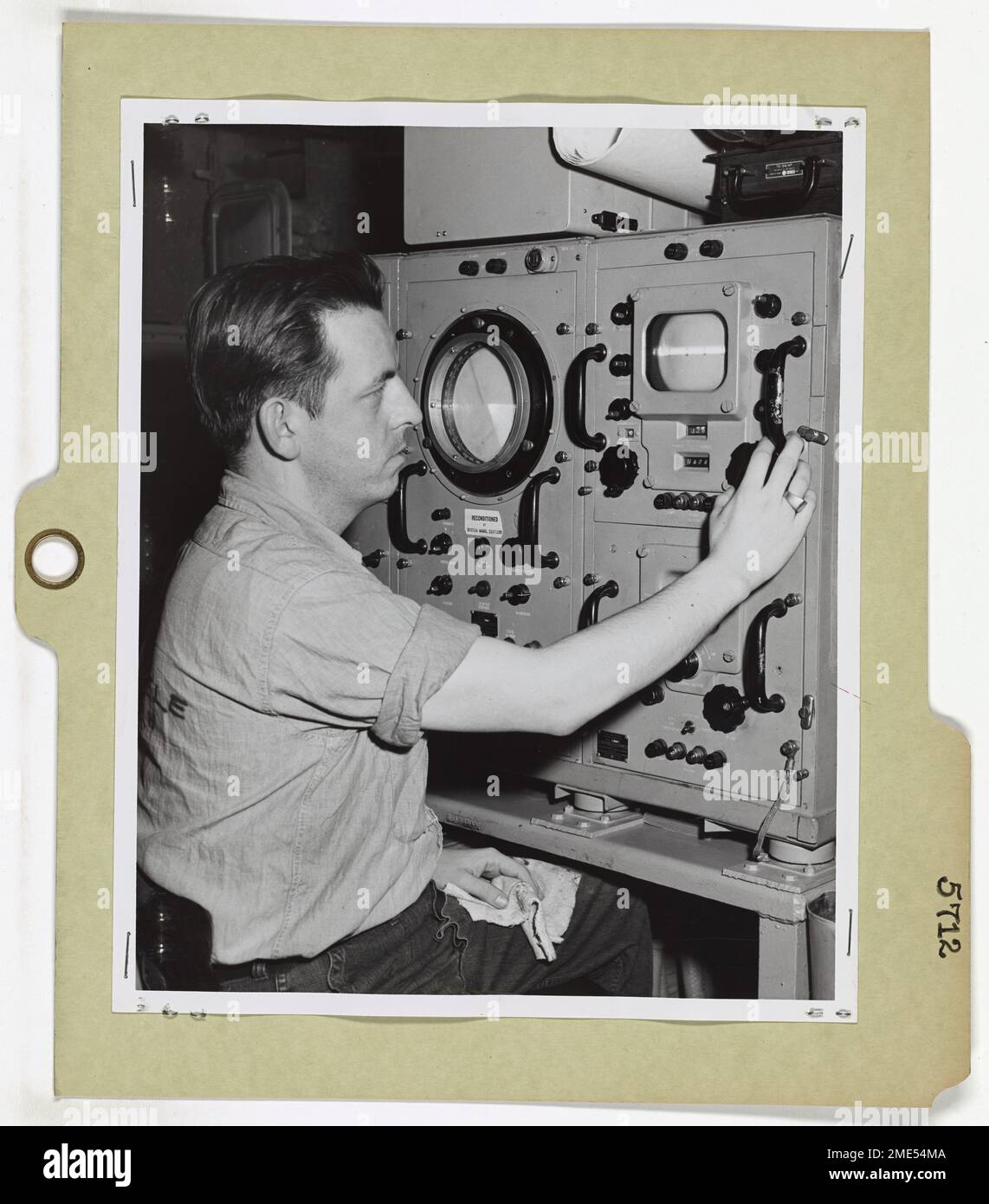 Radarman Robert H. Steele operates air search radar aboard the U.S ...