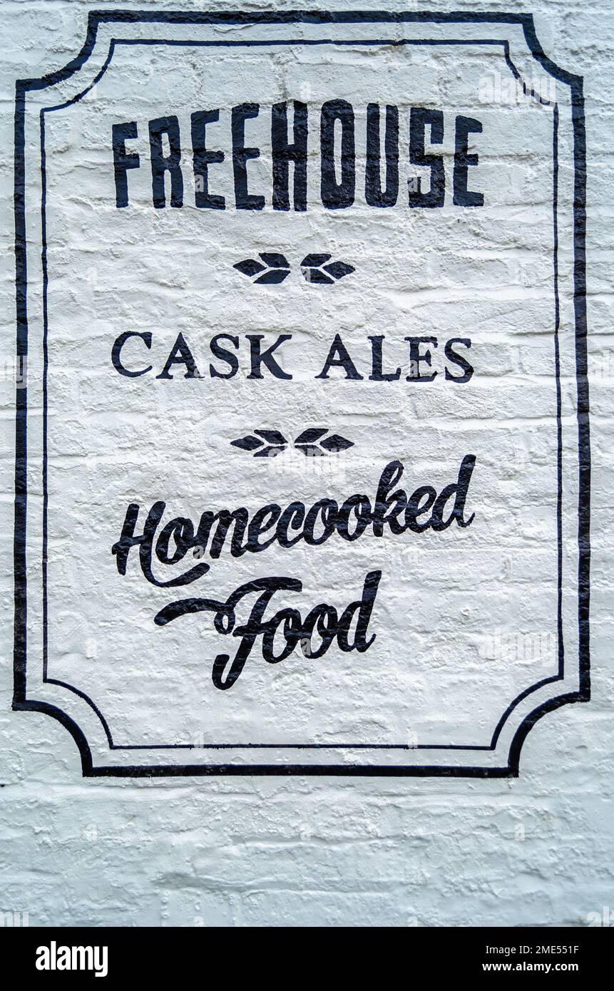 COTTENHAM, ENGLAND, UK - DECEMBER 30, 2013: Sign on the exterior of a ...