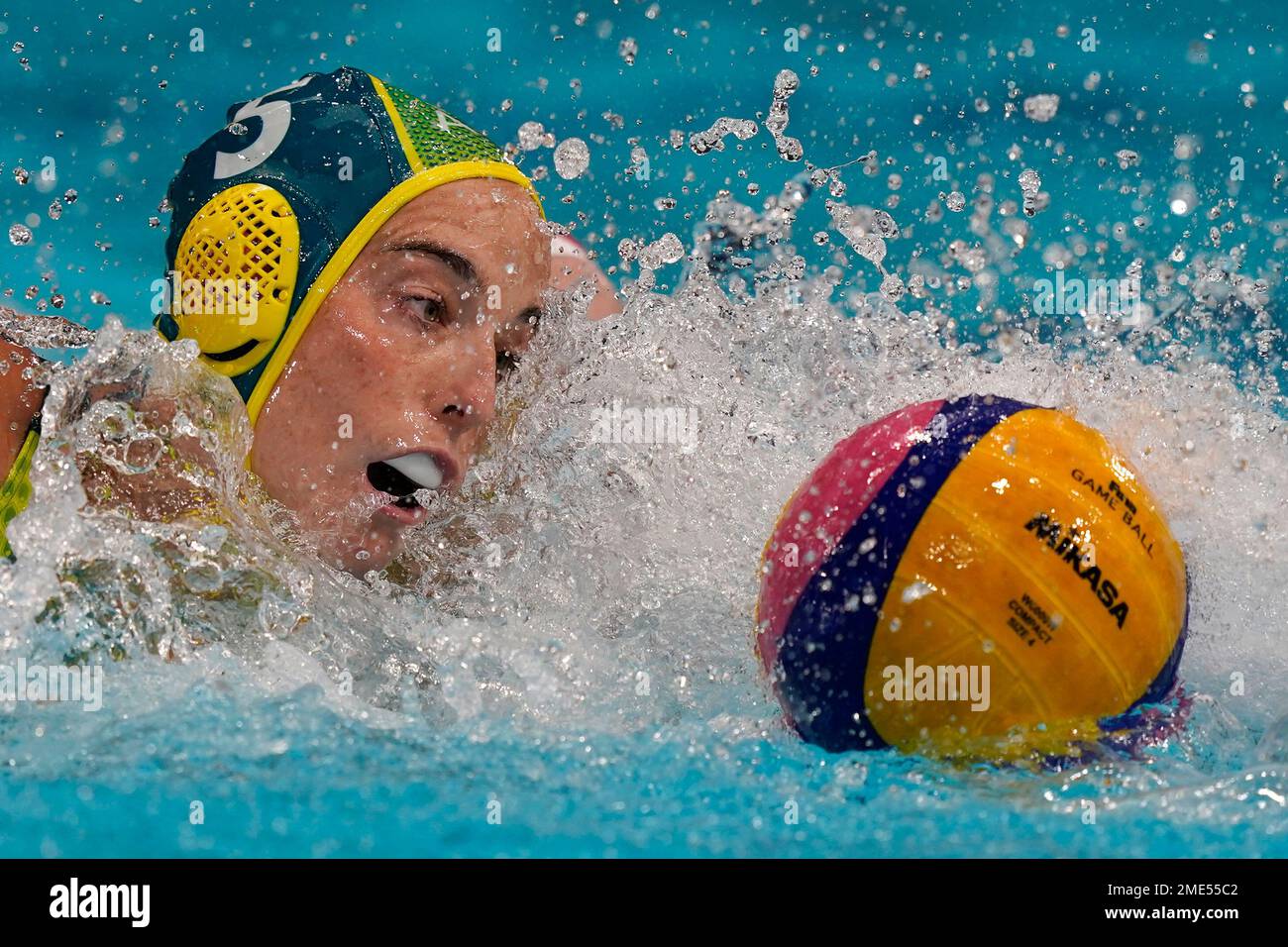 Australia's Elle Armit (5) swims after the ball during a preliminary ...