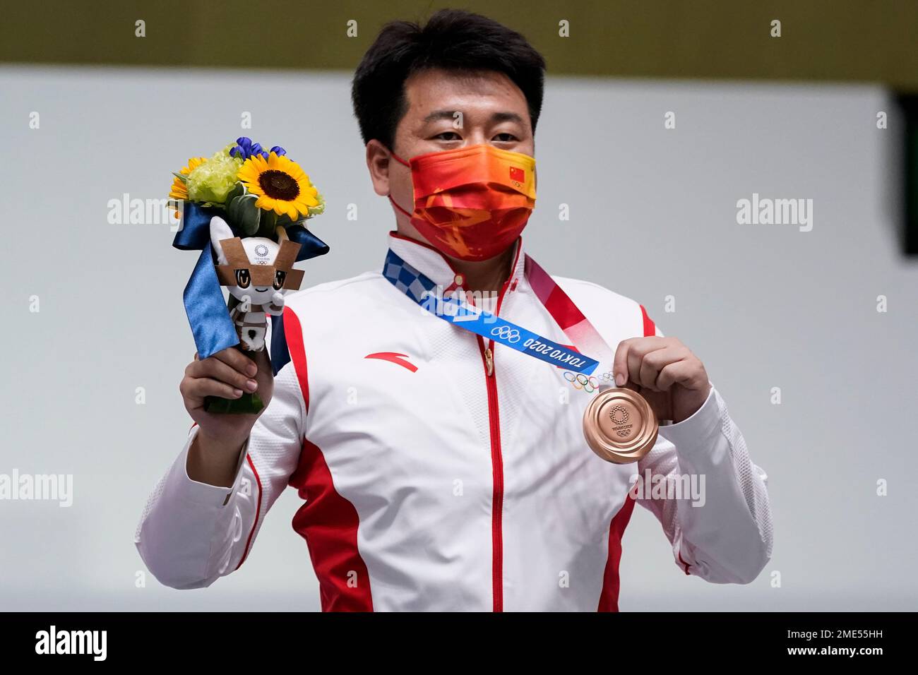 Pang Wei, of China, celebrates after winning the bronze medal in the ...