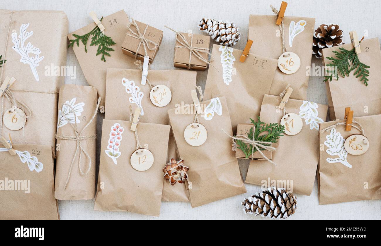 Decorated paper bags with pine cones and cardboard boxes on carpet ...