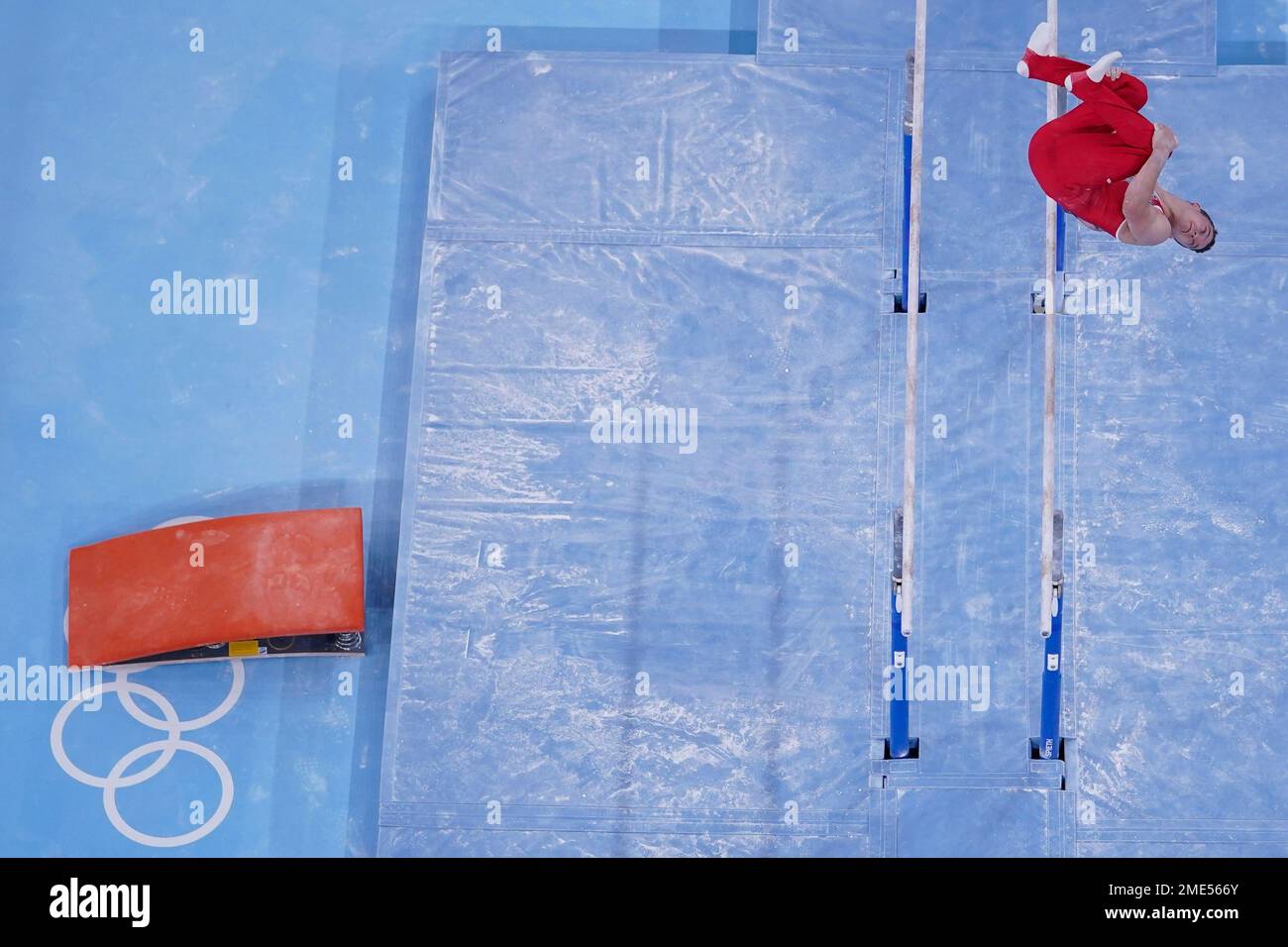 Christian Baumann, of Switzerland, performs on the parallel bars during ...