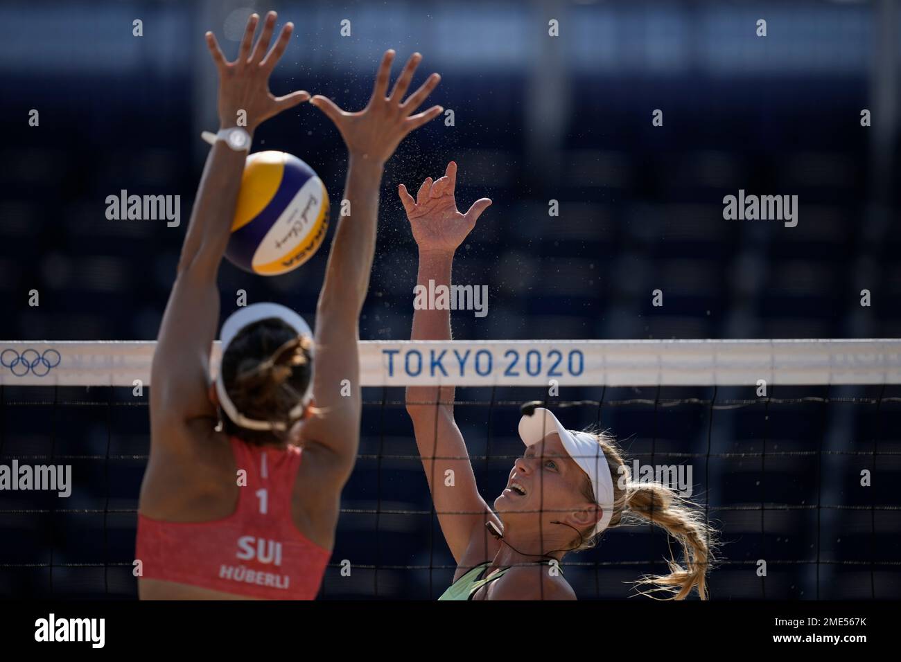 Tanja Huberli, of Switzerland, left, attempts to block against Laura ...