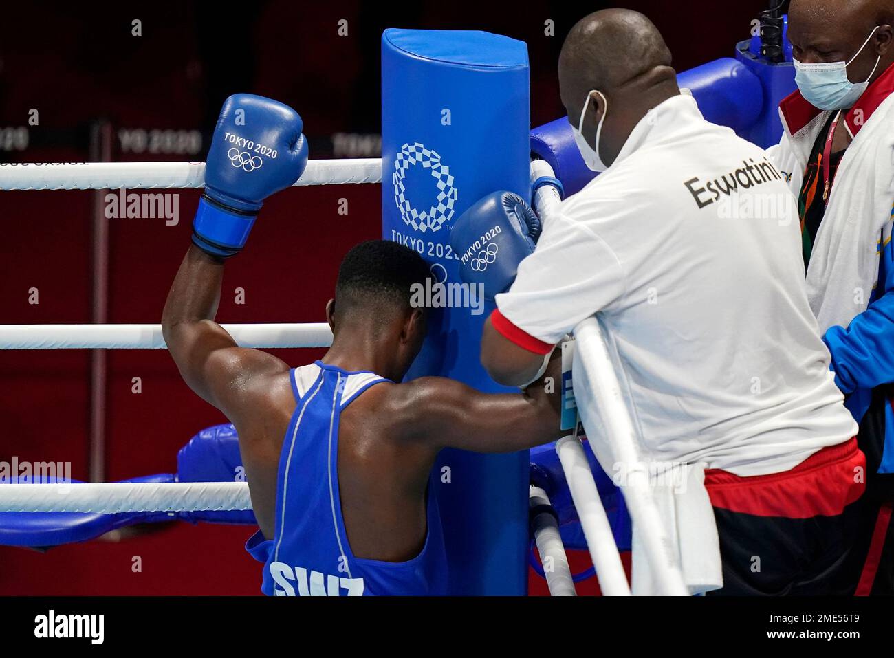 Switzerland's Thabiso Dlamini kneels in his corner during a timeout during a men's welterweight ...