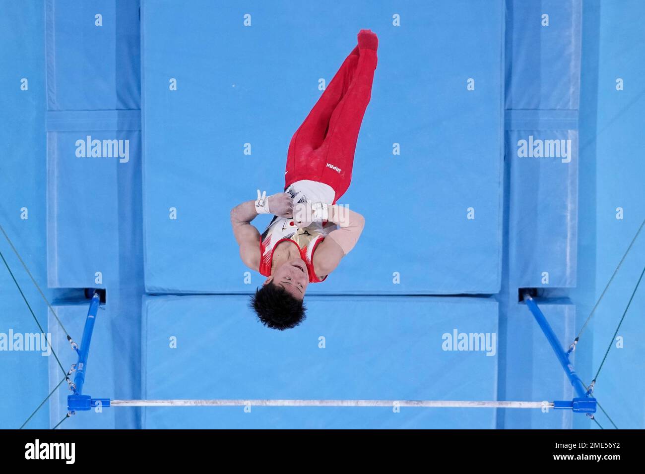 Takeru Kitazono, of Japan, performs on the horizontal bar during men's ...
