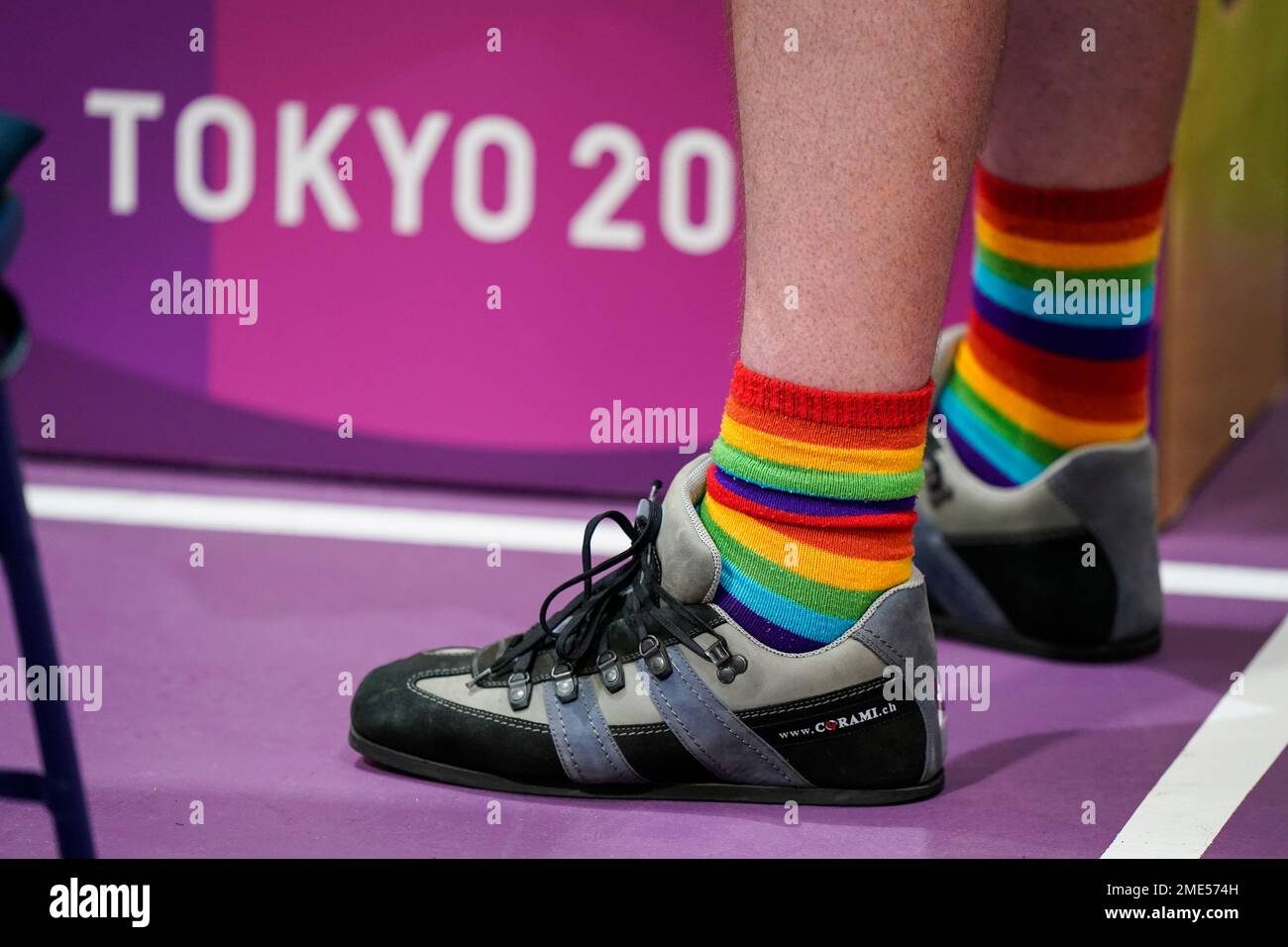 Daniel Repacholi, of Australia, wears colorful socks as he competes in ...