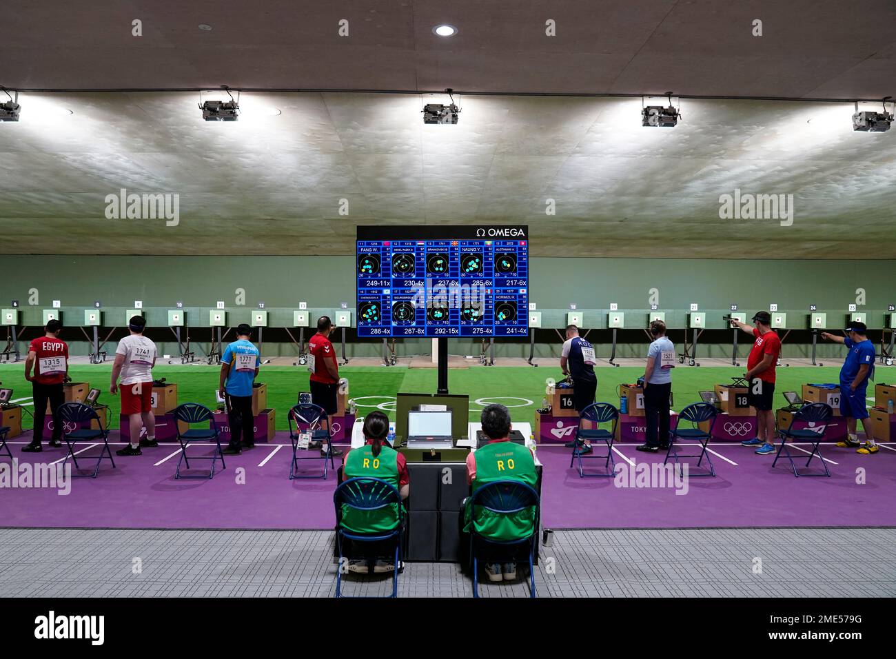 Athletes compete in the men's 10-meter air pistol at the Asaka Shooting ...