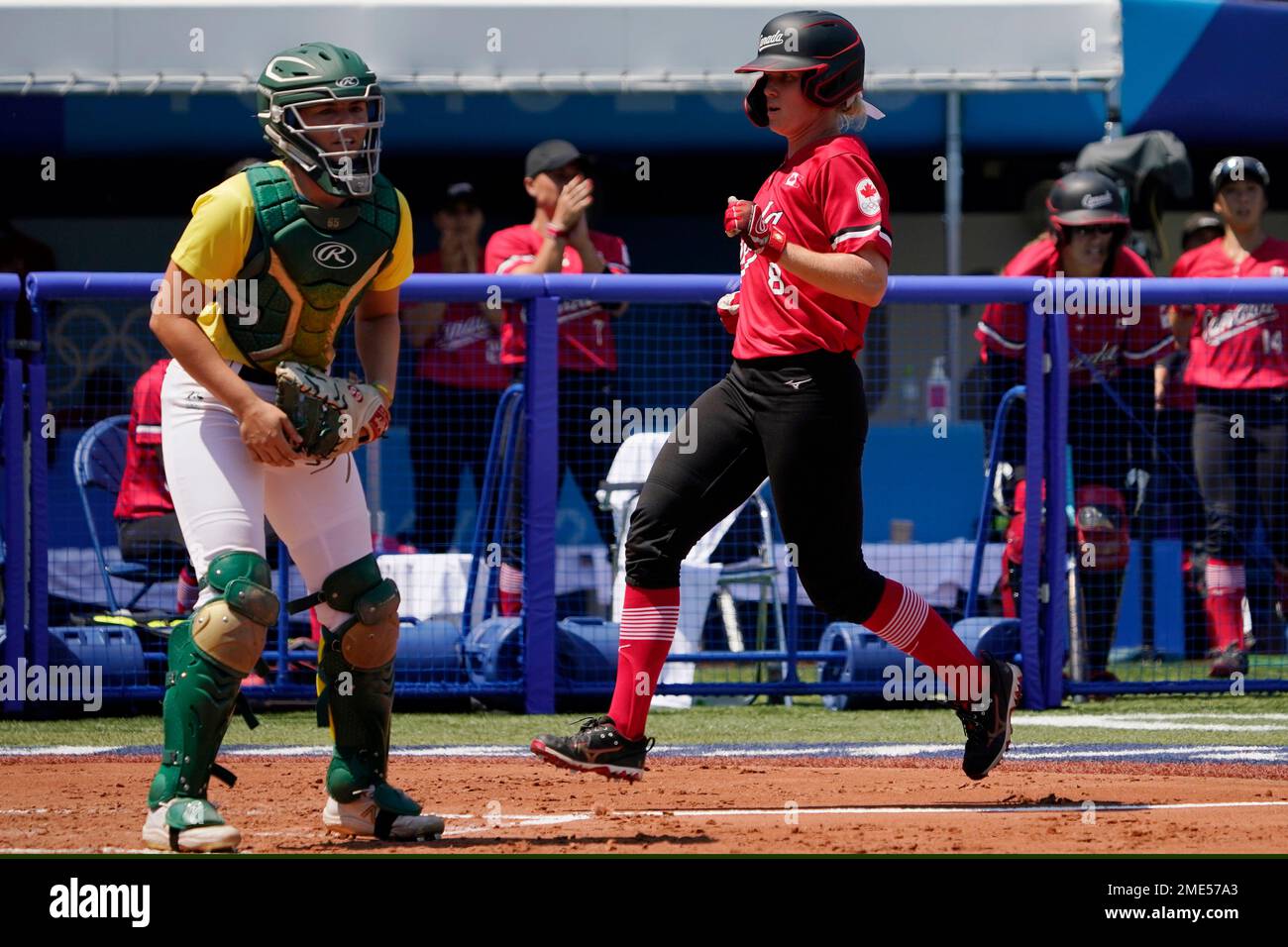 Canada's Victoria Hayward, right, scores behind Australia's catcher ...