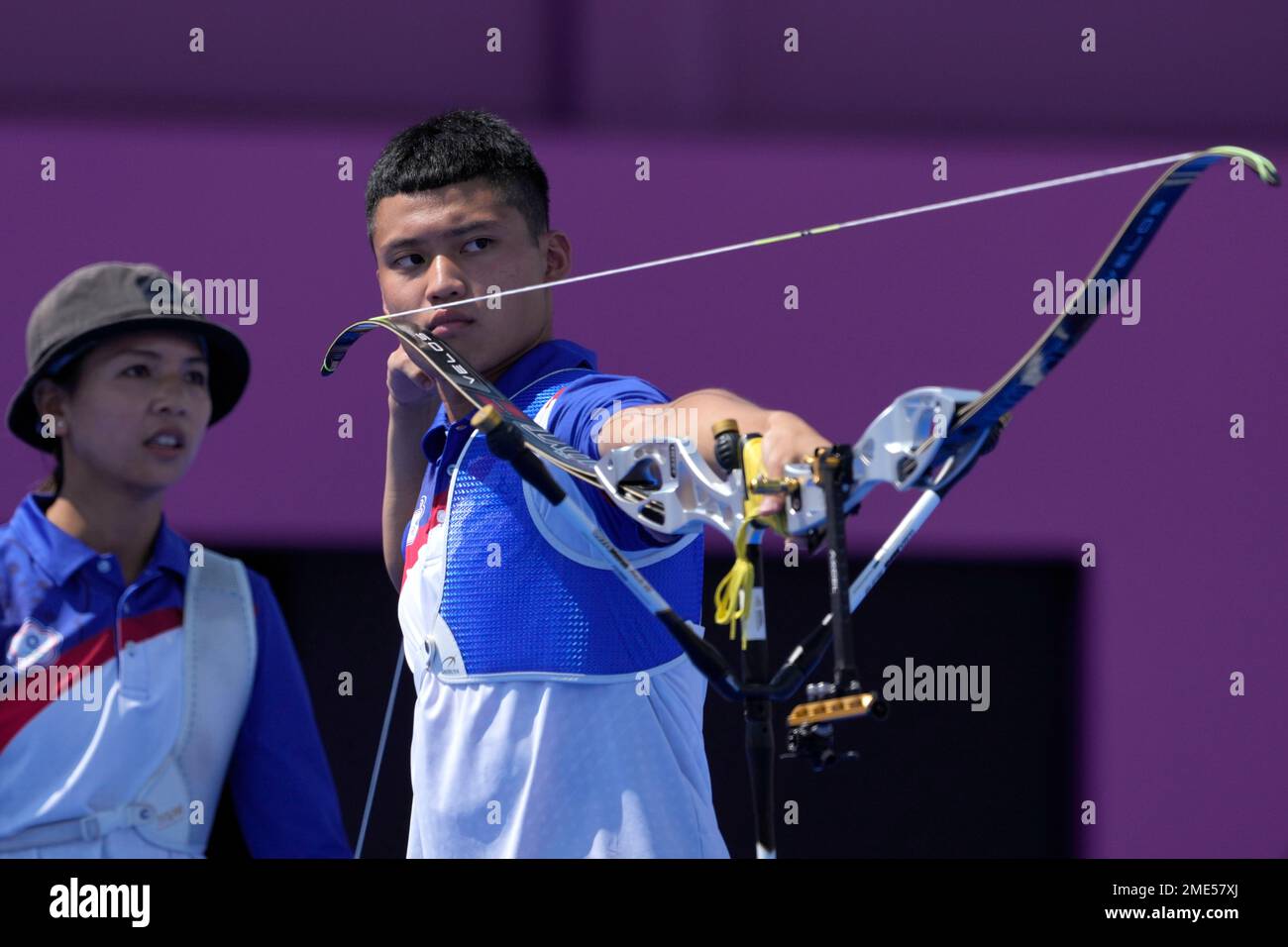 Taiwan's Tang Chih-Chun releases the arrow during the mixed team event ...