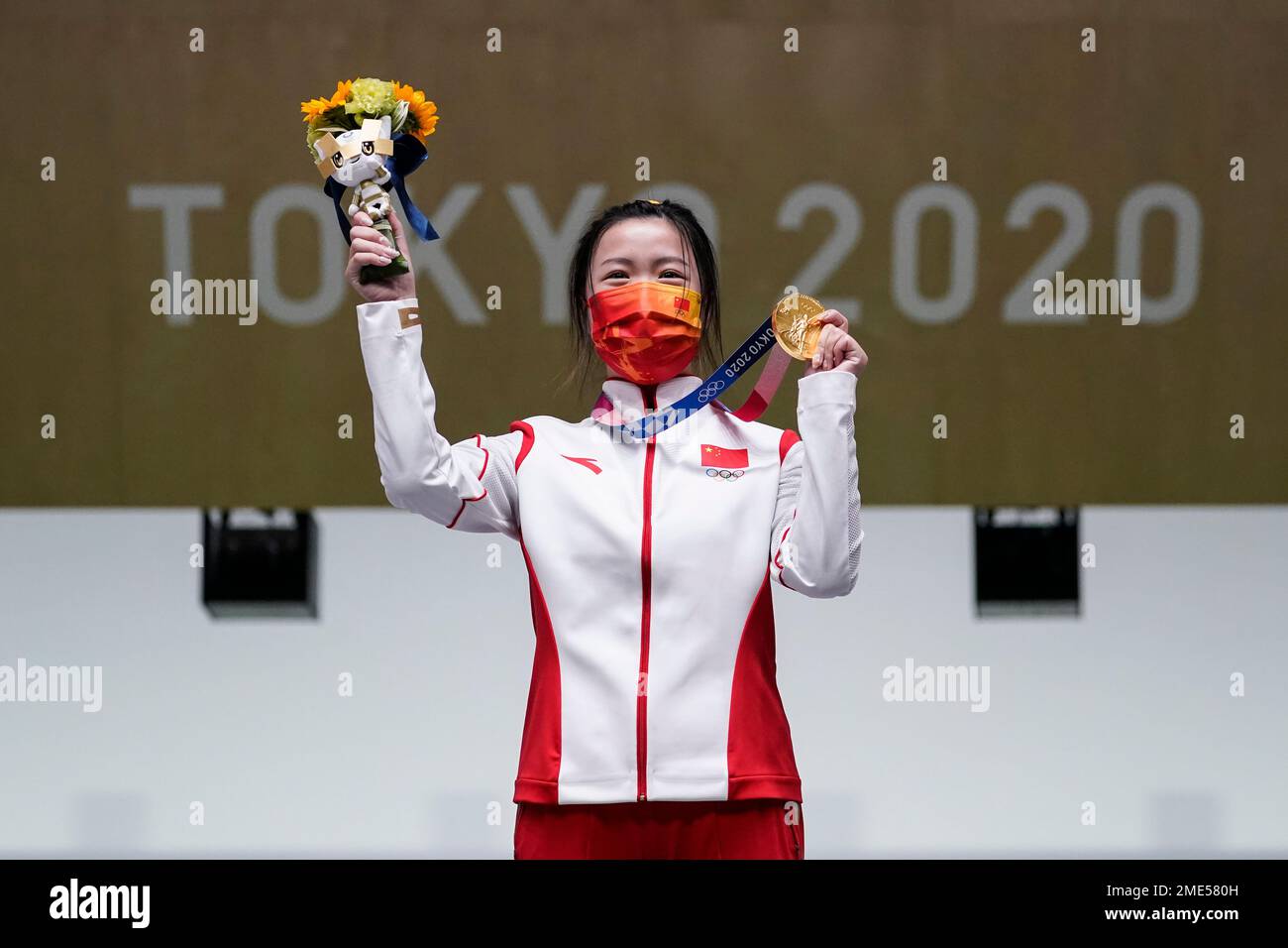 Yang Qian, of China, holds her gold medal after winning the women's 10 ...
