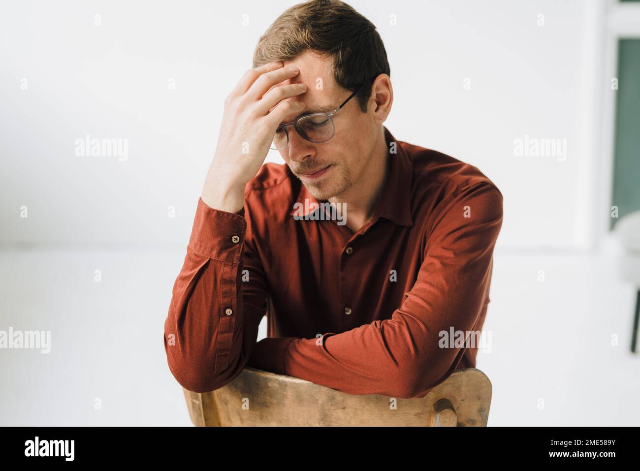 Man sitting chair backrest hi-res stock photography and images - Alamy