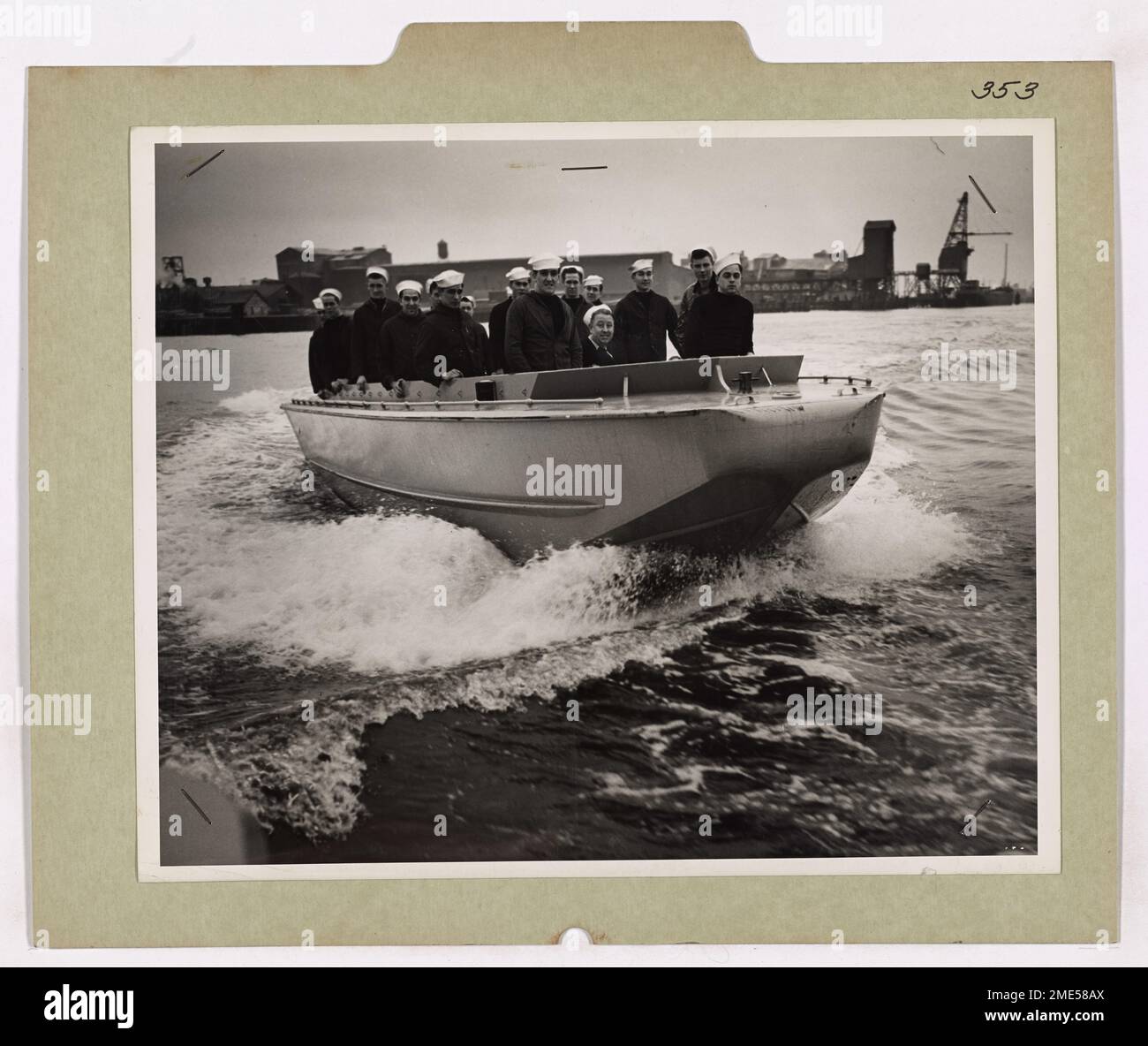 A group of U.S. Coast Guardsmen are depicted performing their duties ...