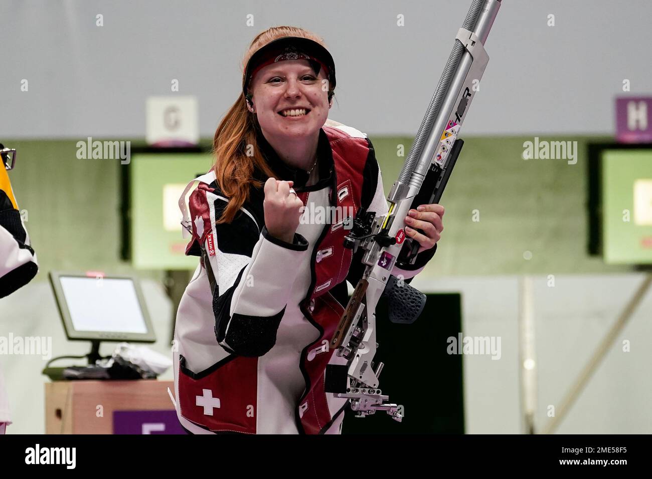 Nina Christen, of Switzerland, celebrates after winning the bronze ...