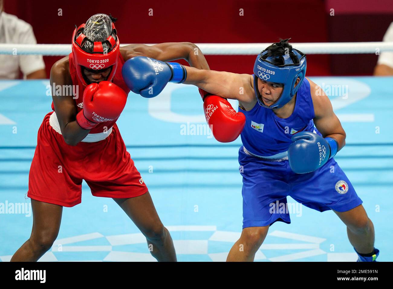 Philippines' Nesthy Petecio, right, exchanges punches with Democratic ...