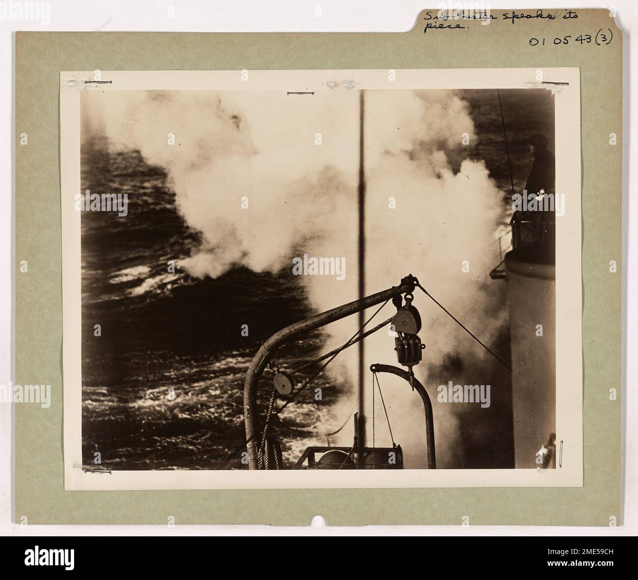 The image captures the firing of a 5-inch gun aboard a Coast Guard ...