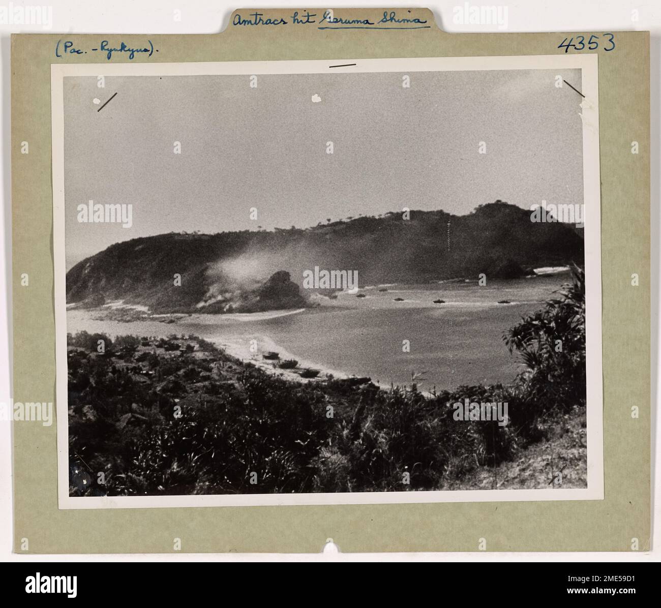 Army amtracs from Coast Guard-manned LSTs land on the shores of Geruma ...