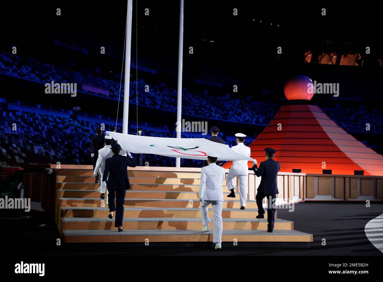 The Olympic flag is carried during the opening ceremony in the Olympic ...
