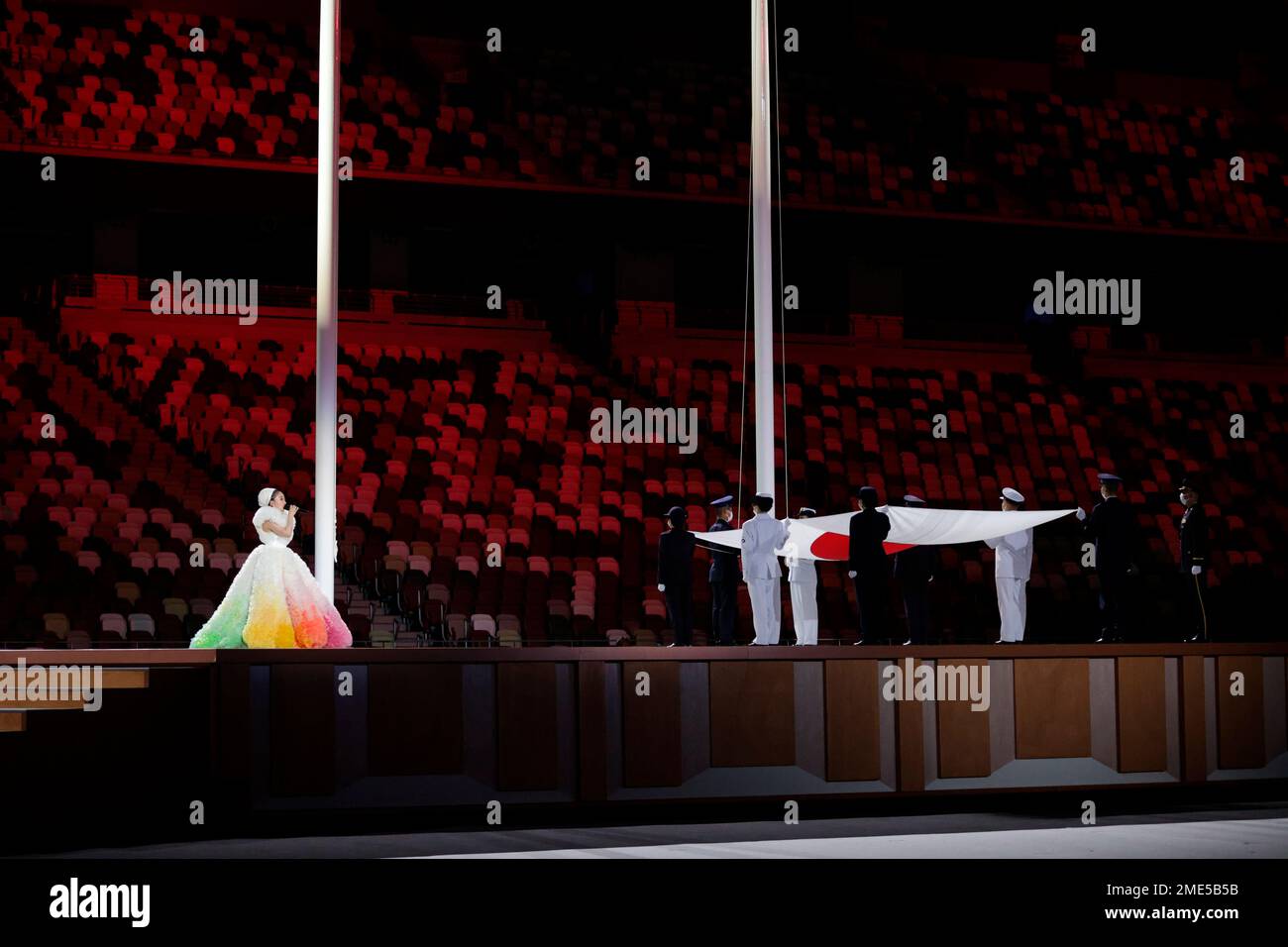 The Japan flag is carried in during the opening ceremony in the Olympic ...