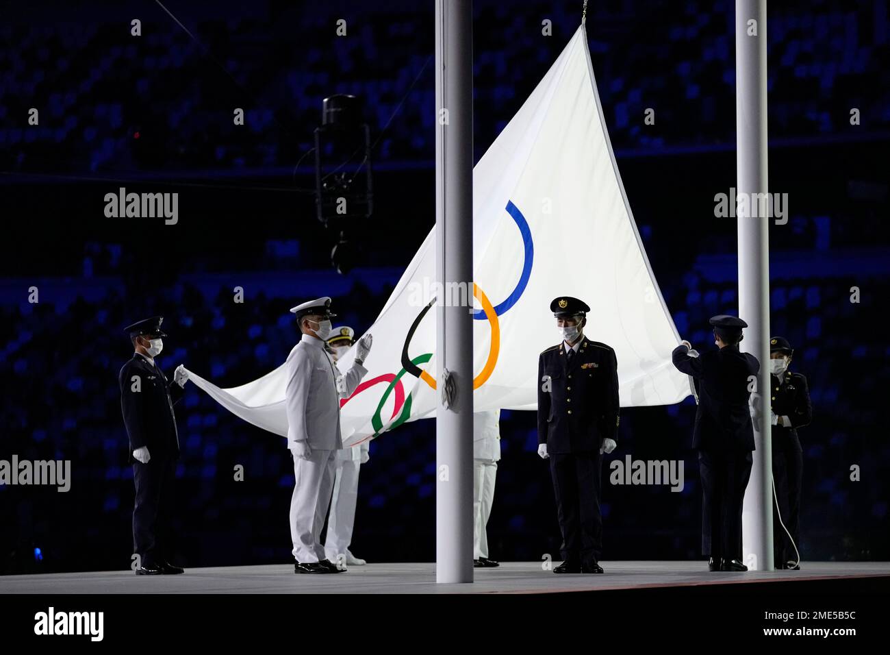 The Olympic flag is raised during the opening ceremony in the Olympic ...