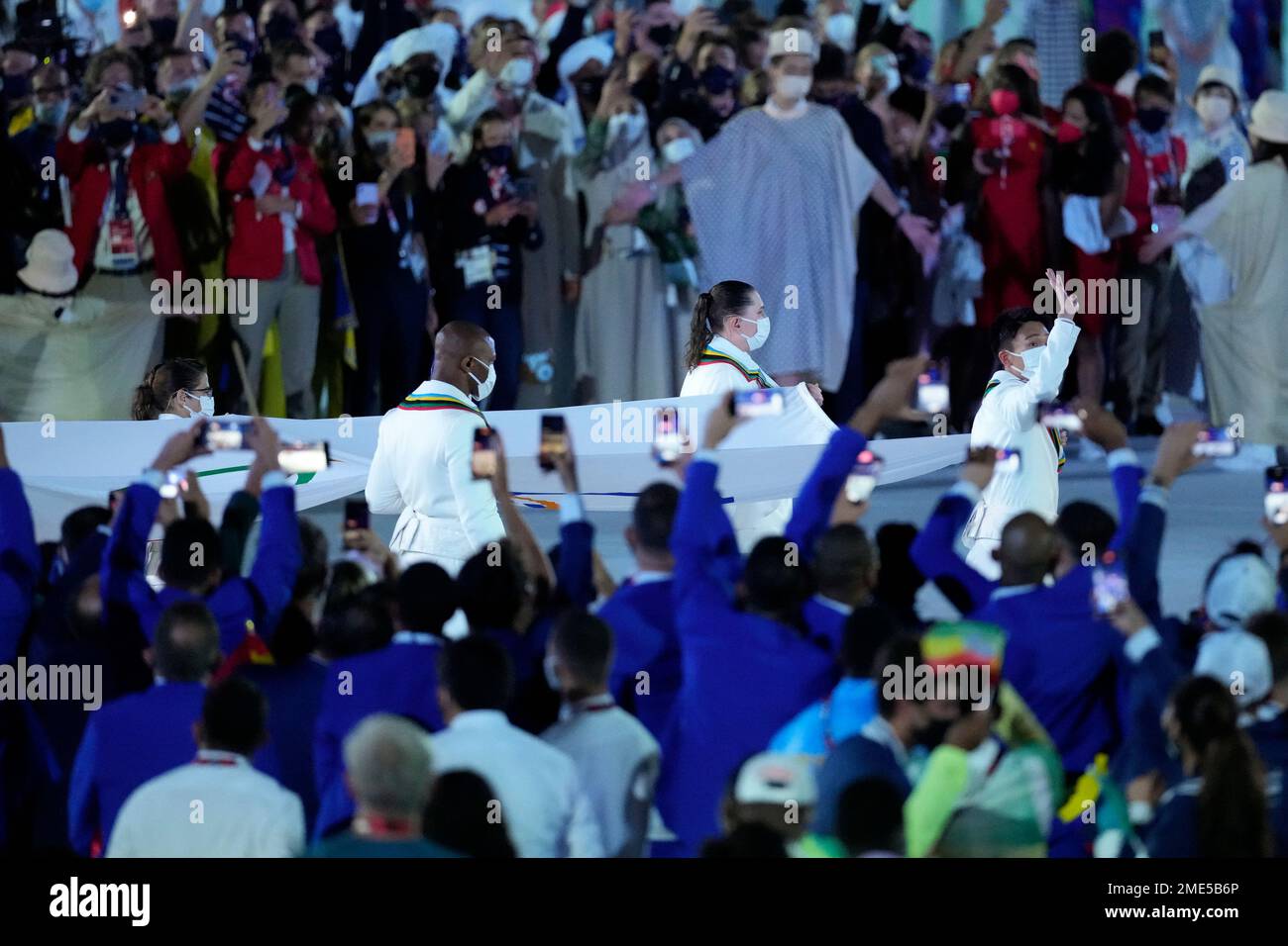 The Olympic flag is brought into the stadium during the opening ...