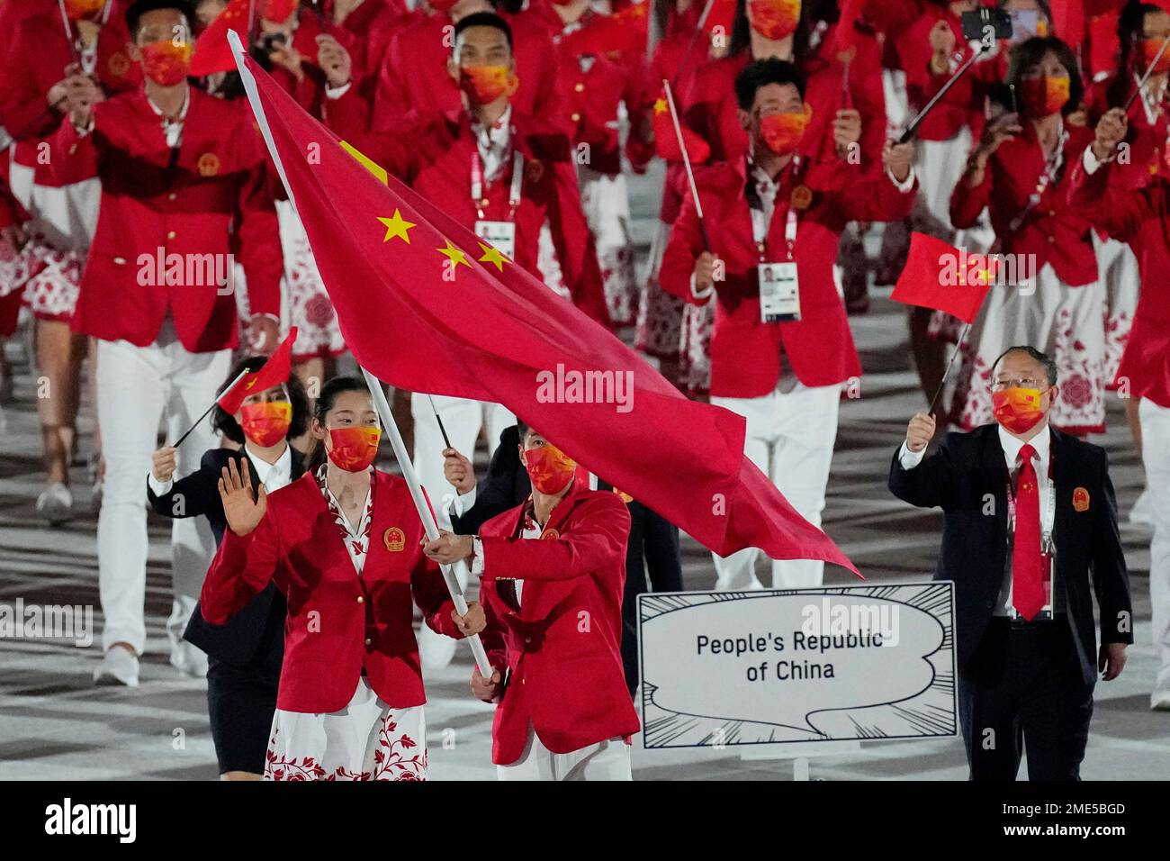 Zhu Ting and Zhao Shuai, of China, carry their country's flag during ...