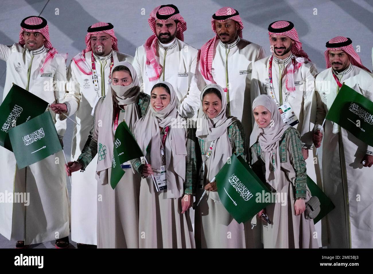 Athletes from Saudi Arabia's stand for a picture during the opening ...
