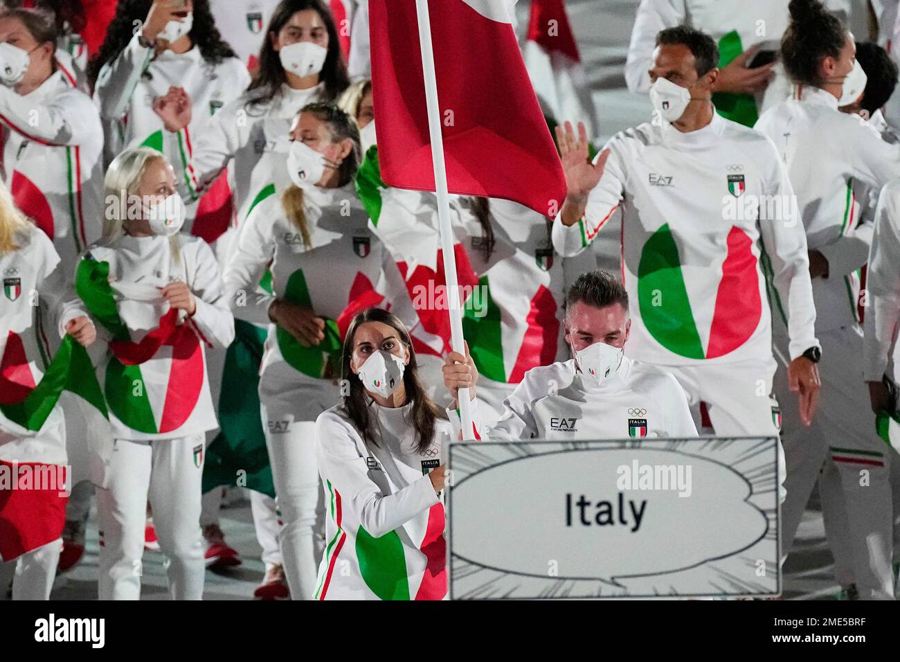 Jessica Rossi and Elia Viviani, of Italy, carry their country's flag ...