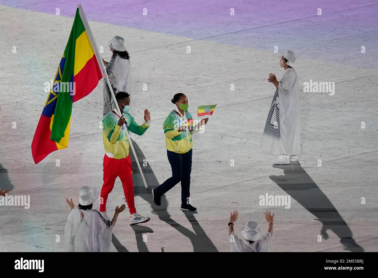 Abdelmalik Muktar, of Ethiopia, carries his country's flag during the ...