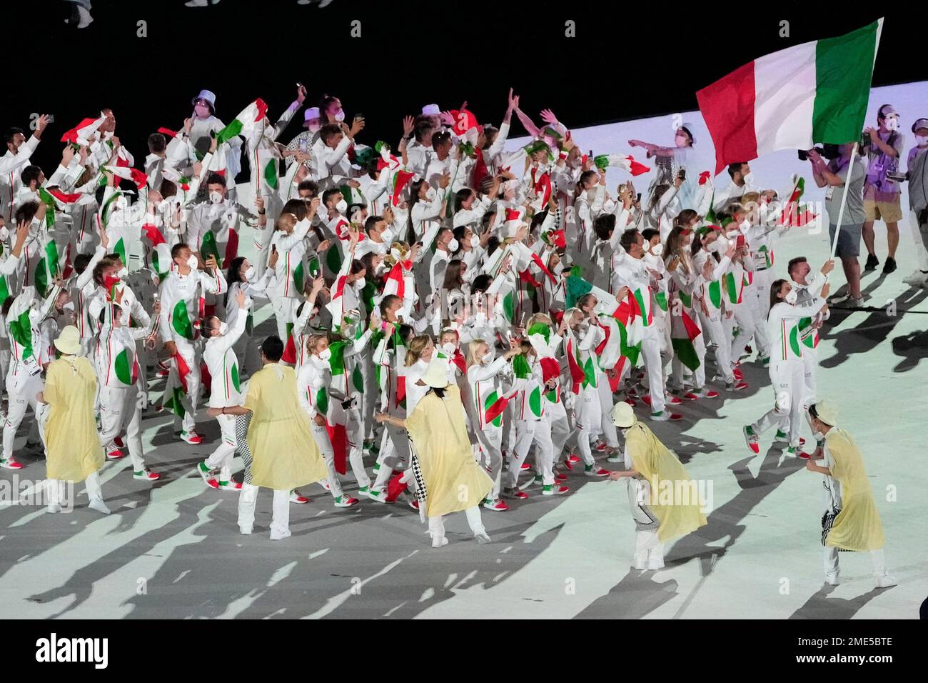 Jessica Rossi and Elia Viviani, of Italy, carry their country's flag ...