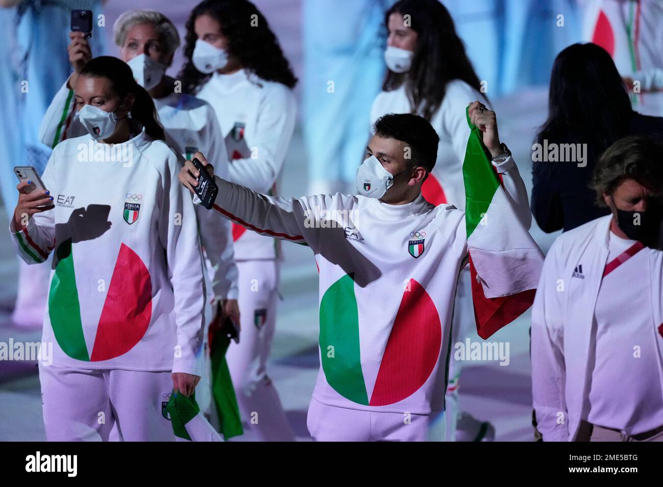 Italian athletes march into the stadium during the opening ceremony in ...