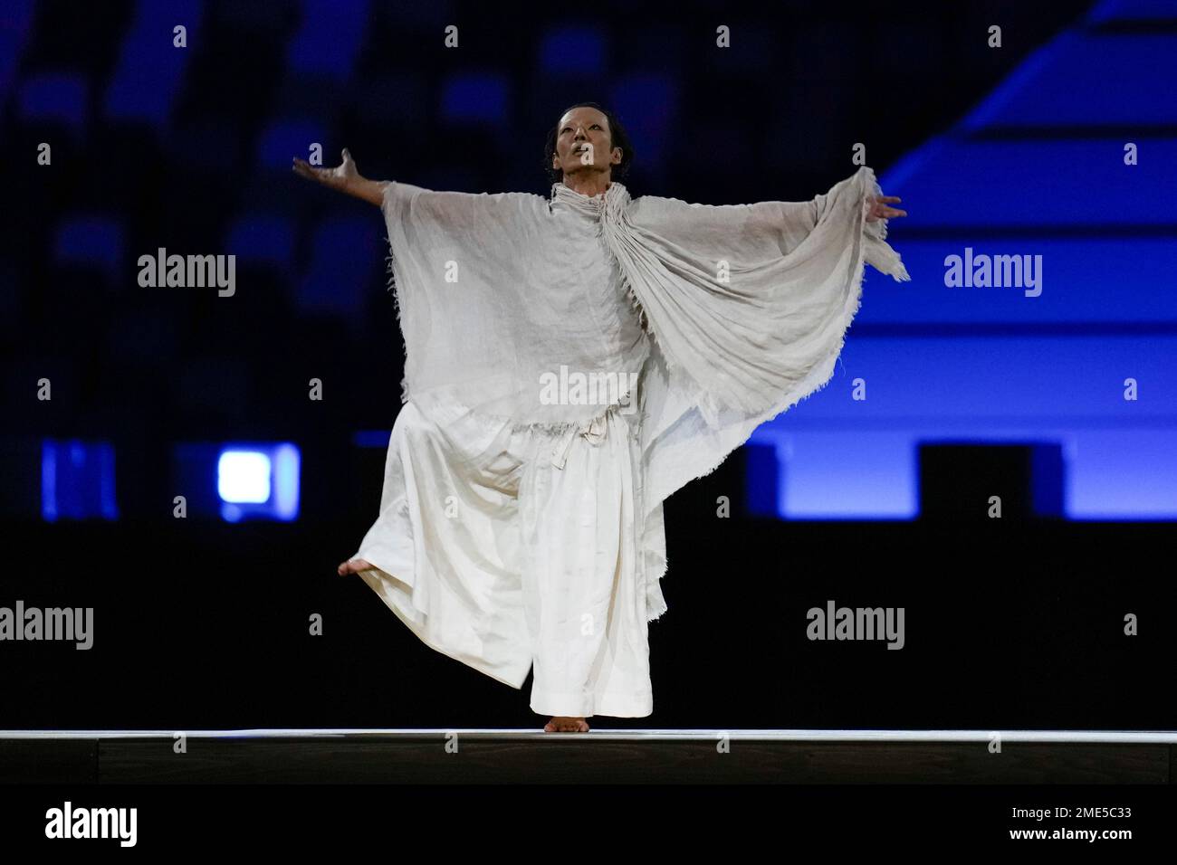 A dancer performs during the opening ceremony in the Olympic Stadium at ...
