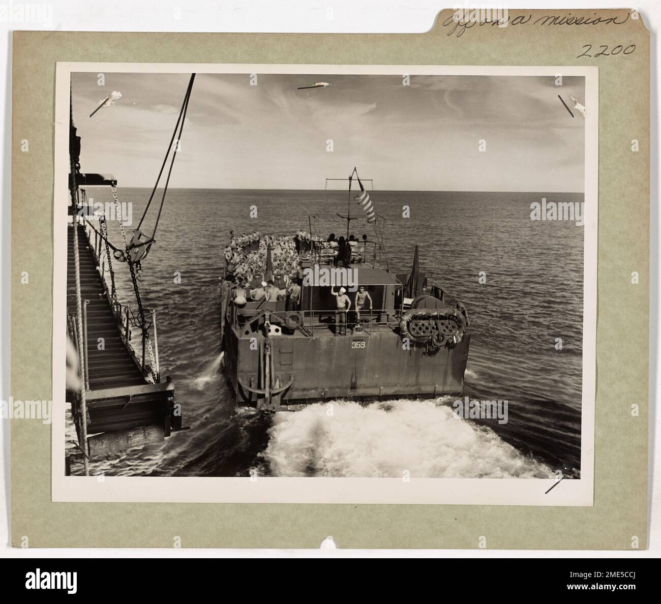An LCT (Landing Craft Tank) pulls away from a Coast Guard-manned ...