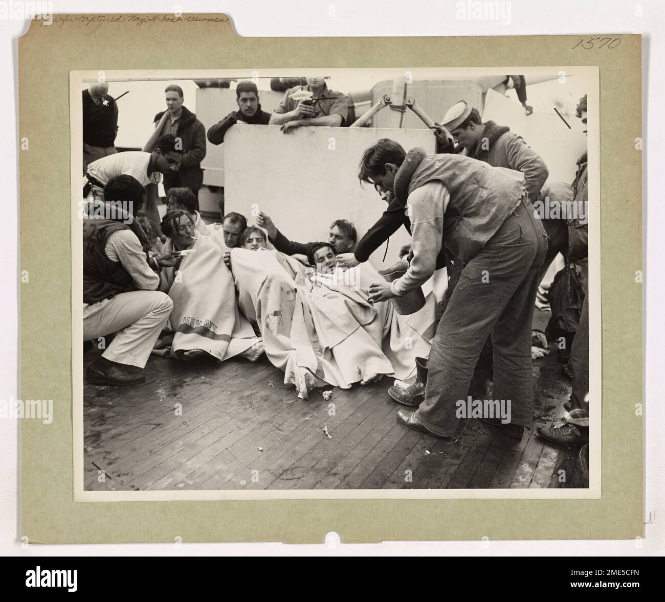 Coast Guardsman John Tumas serves coffee to captured German sailors ...