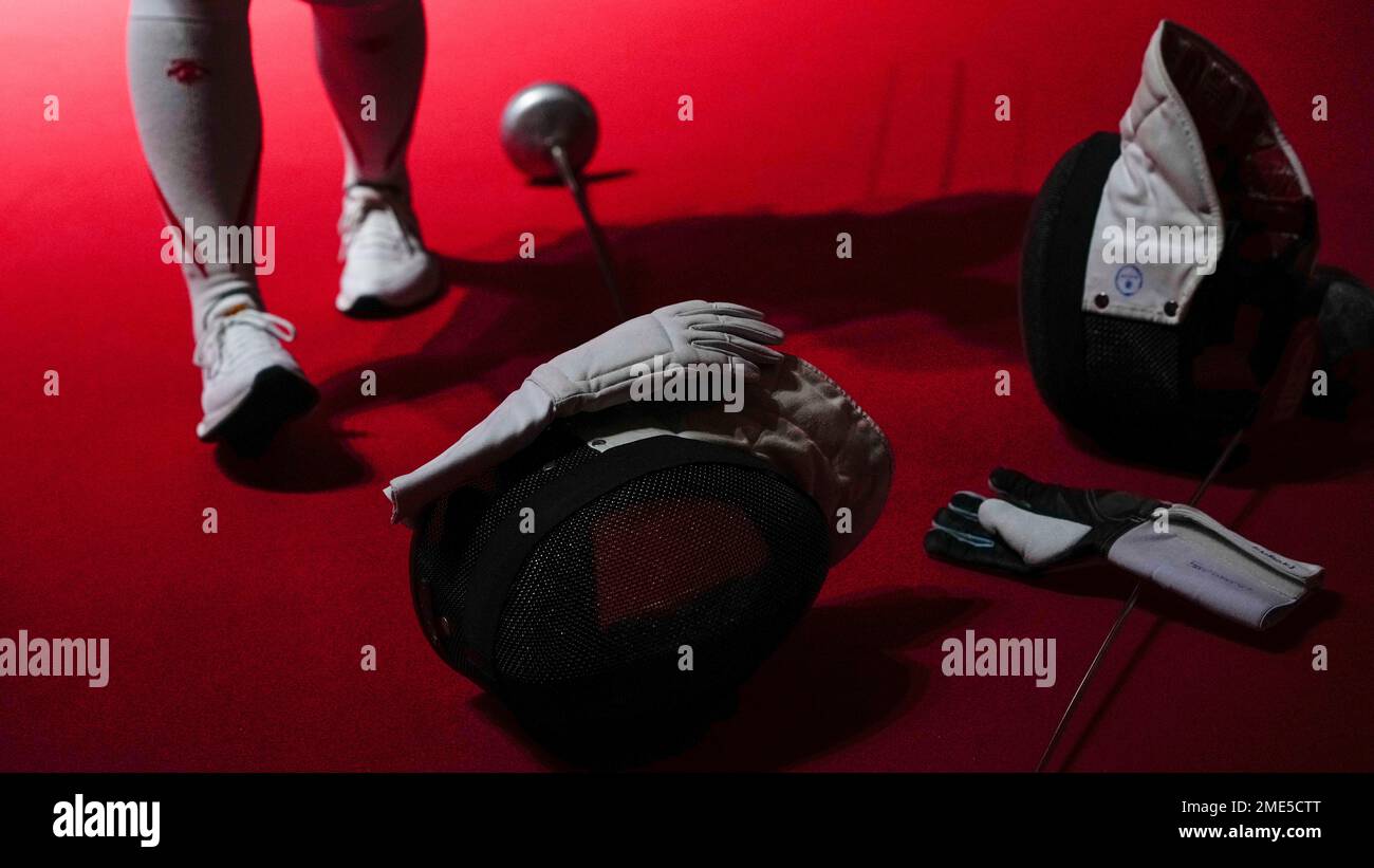 A worker walks past fencing equipment used for testing at the Makuhari ...
