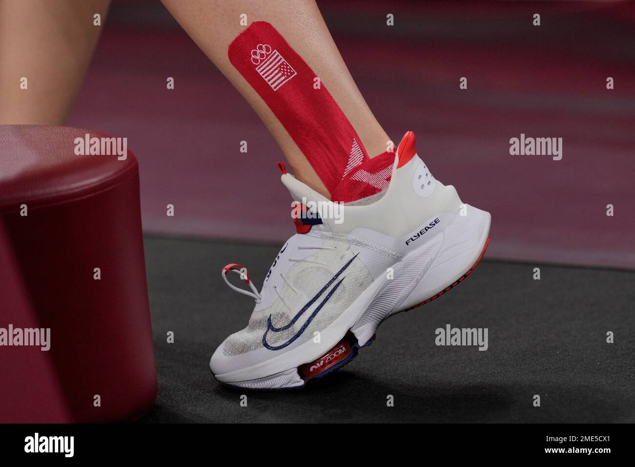 Lily Zhang, of United States walks with a sports tape on her leg during ...
