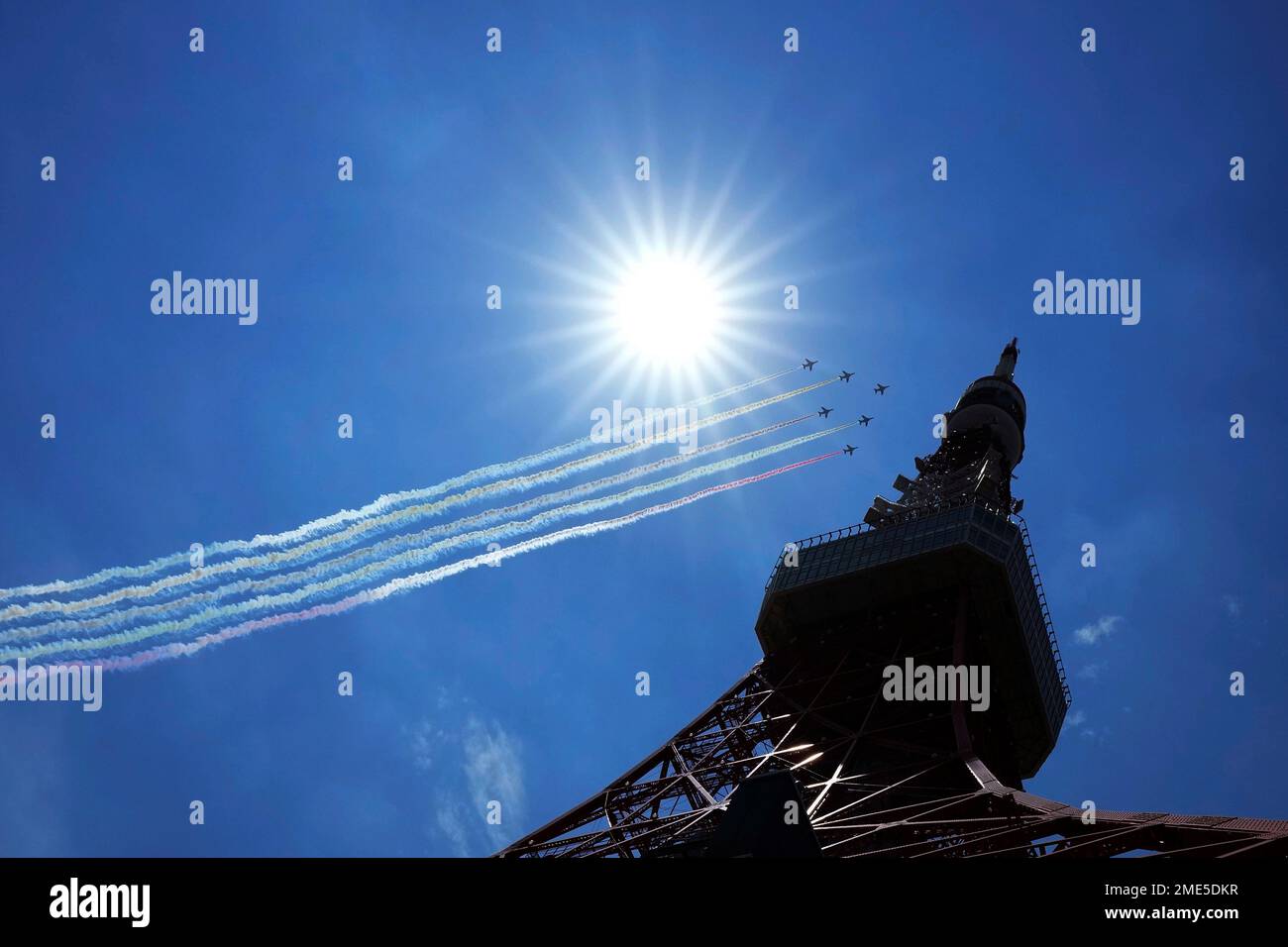 Blue Impulse of the Japan Air Self-Defense Force flies over Tokyo Tower ...