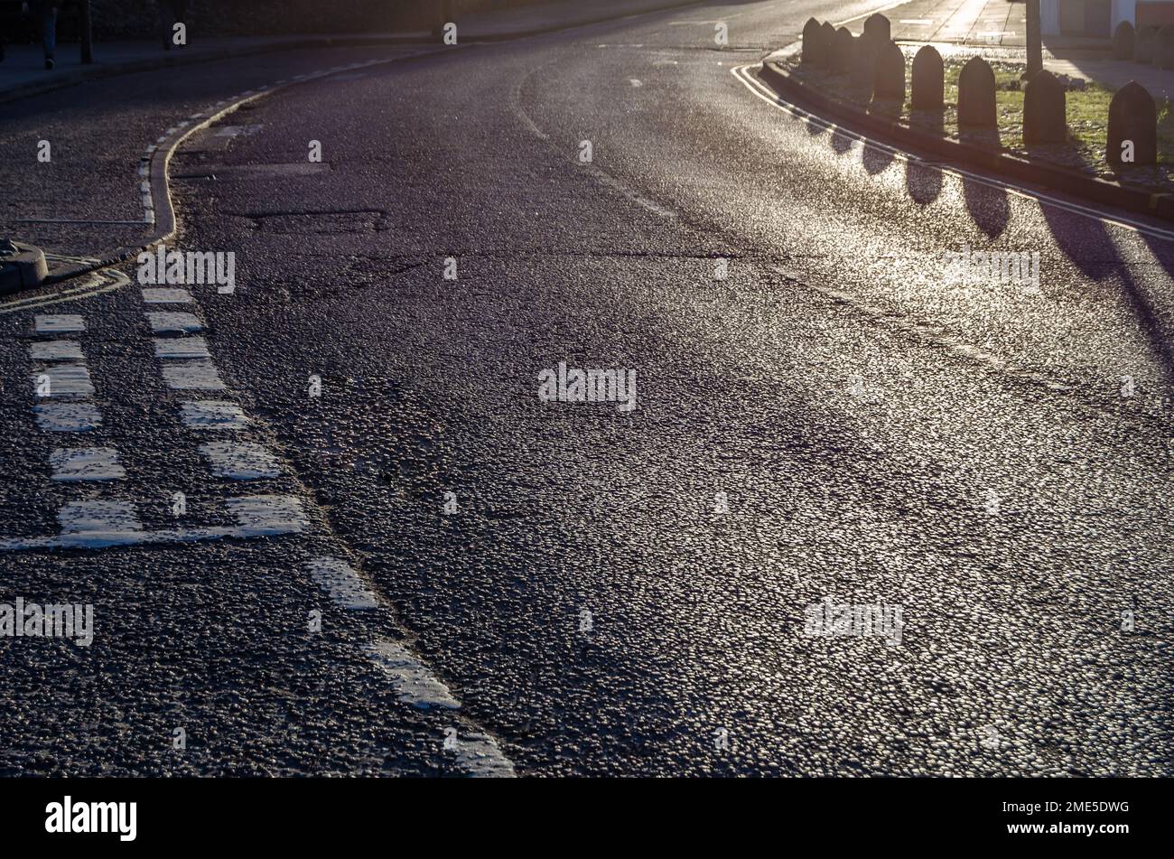 View of the curve of a street, textured background Stock Photo - Alamy