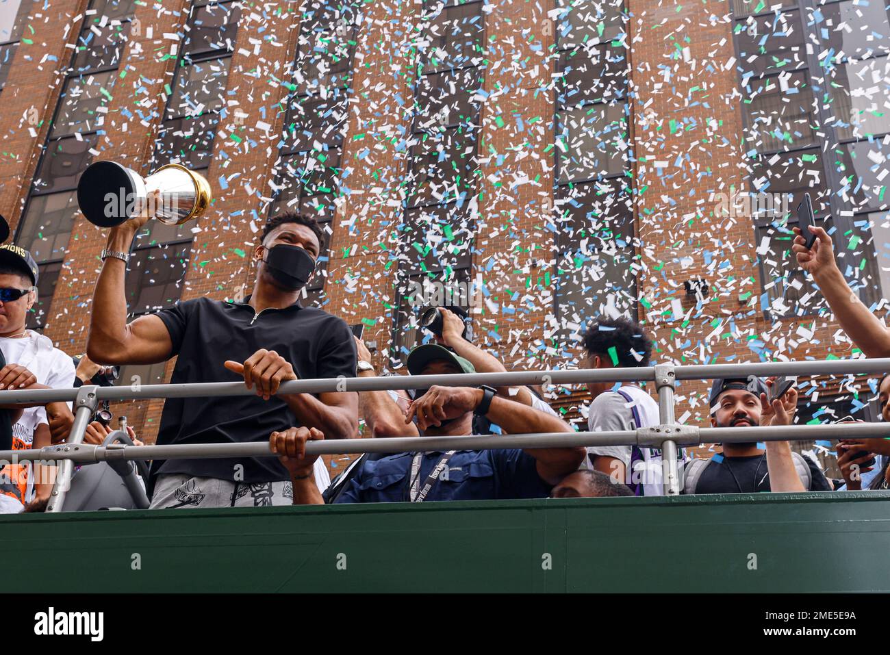 Milwaukee Bucks' Giannis Antetokounmpo holds up the MVP trophy during a ...