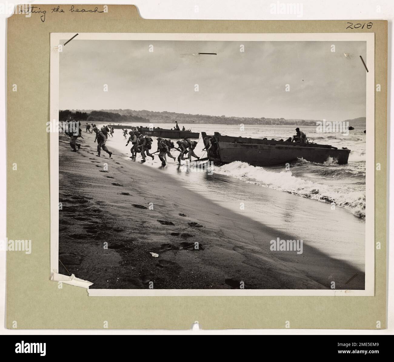This image depicts British soldiers disembarking from a Coast Guard ...