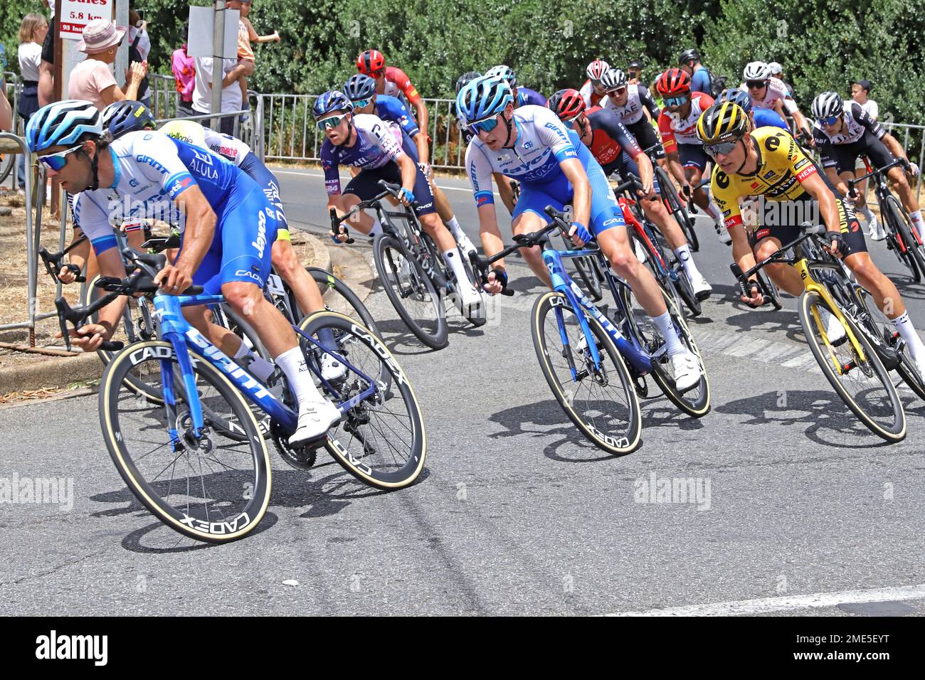Riders negotiating the final turn prior to the finish line in stage 3 ...