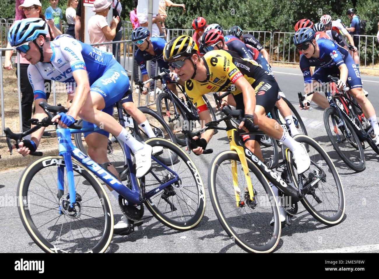 Riders negotiating the final turn prior to the finish line in stage 3 ...