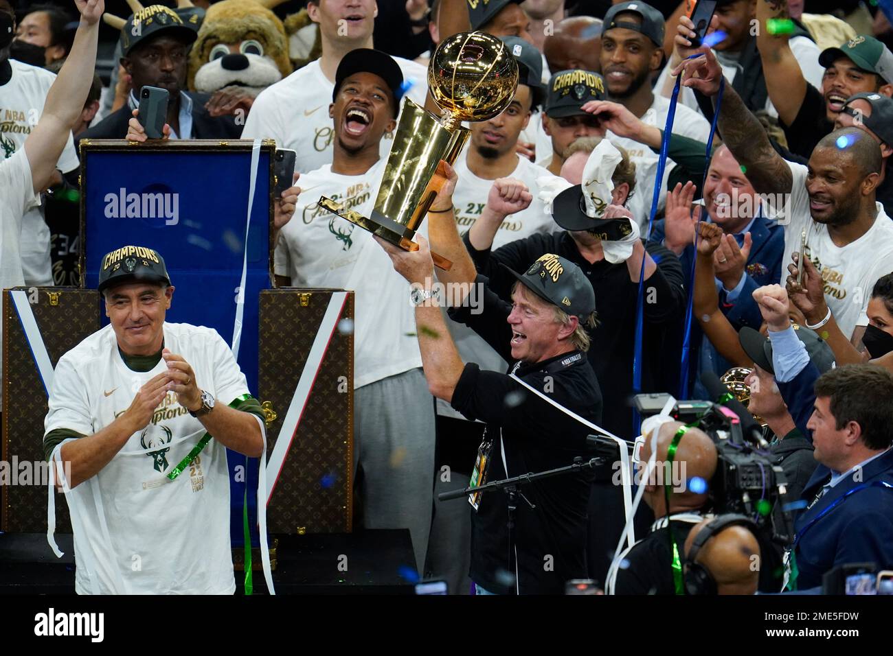 Milwaukee Bucks' co-owner Wes Edens holds up the championship trophy ...